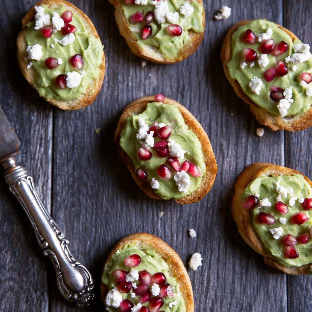 Whipped Feta & Avocado Crostini with Pomegranate - Ambitious Kitchen